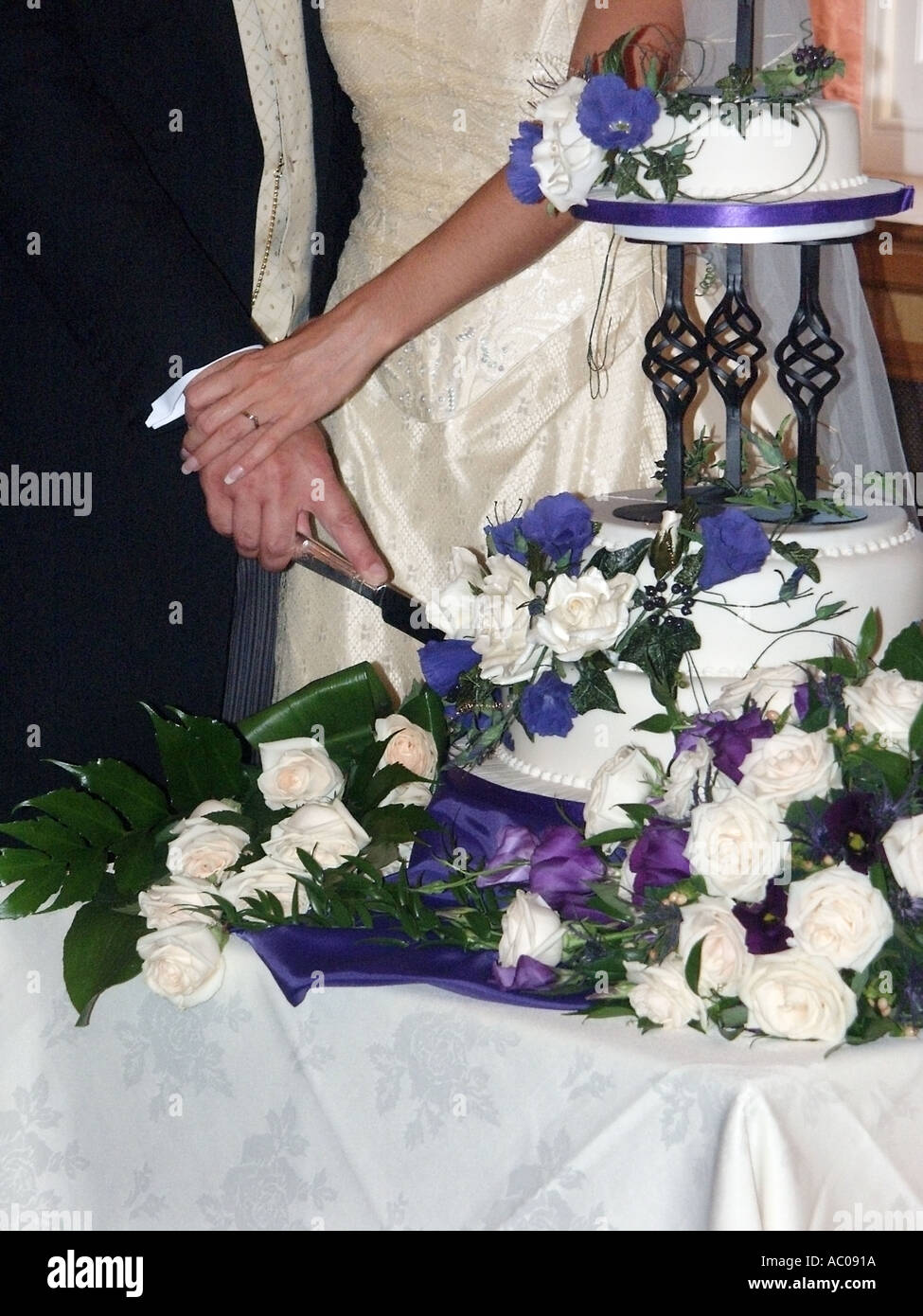 Essex indoor hotel reception wedding breakfast ceremonial cutting of ...