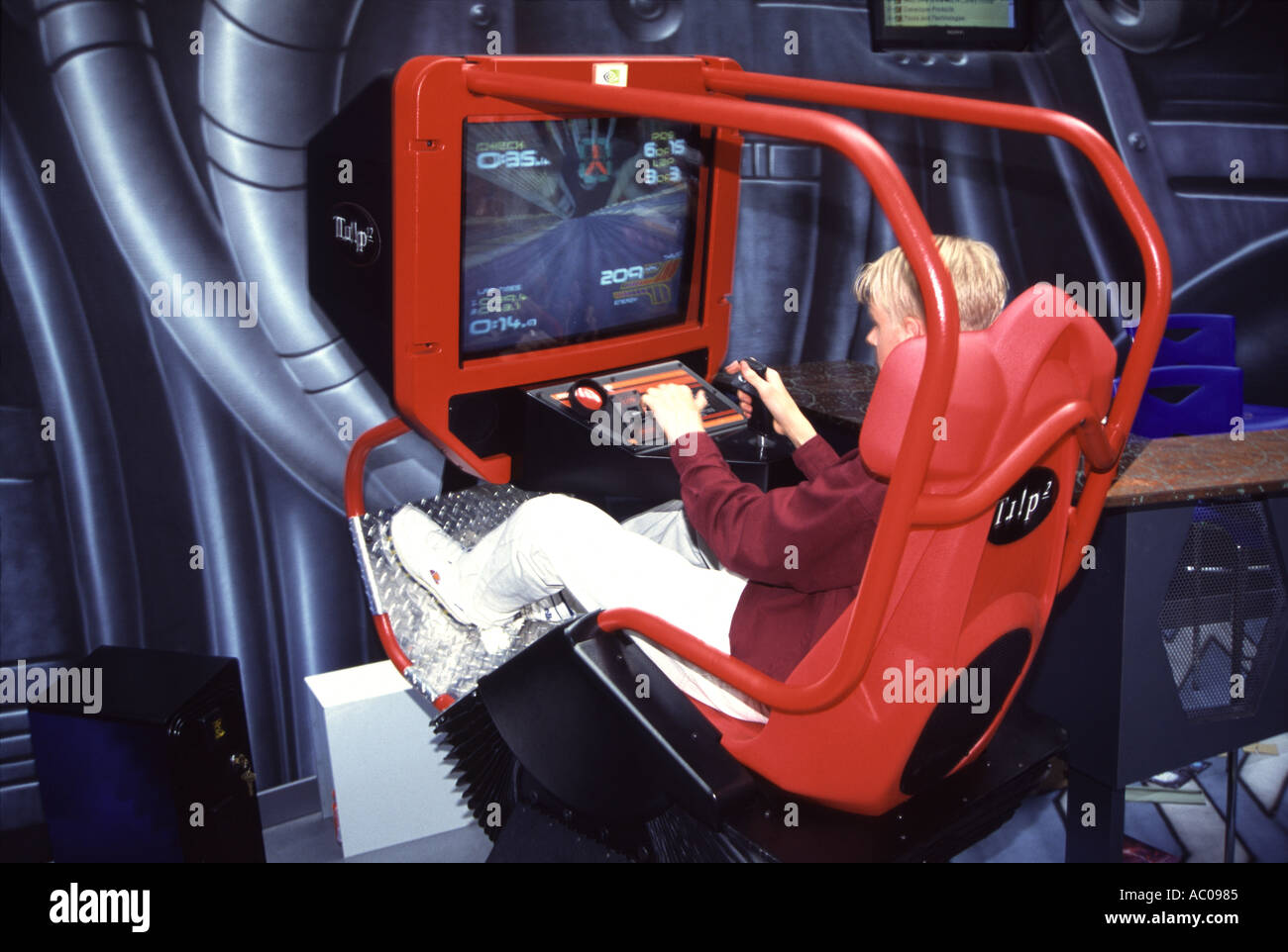 Children playing early video game hi-res stock photography and images ...