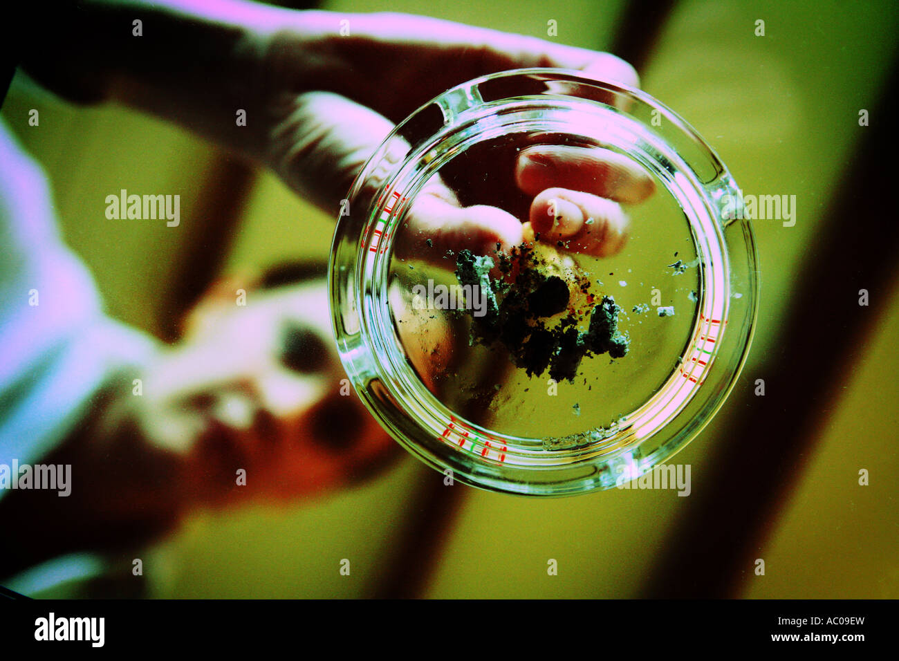 A female smoker about to stub out extinguish her finished smoked ...