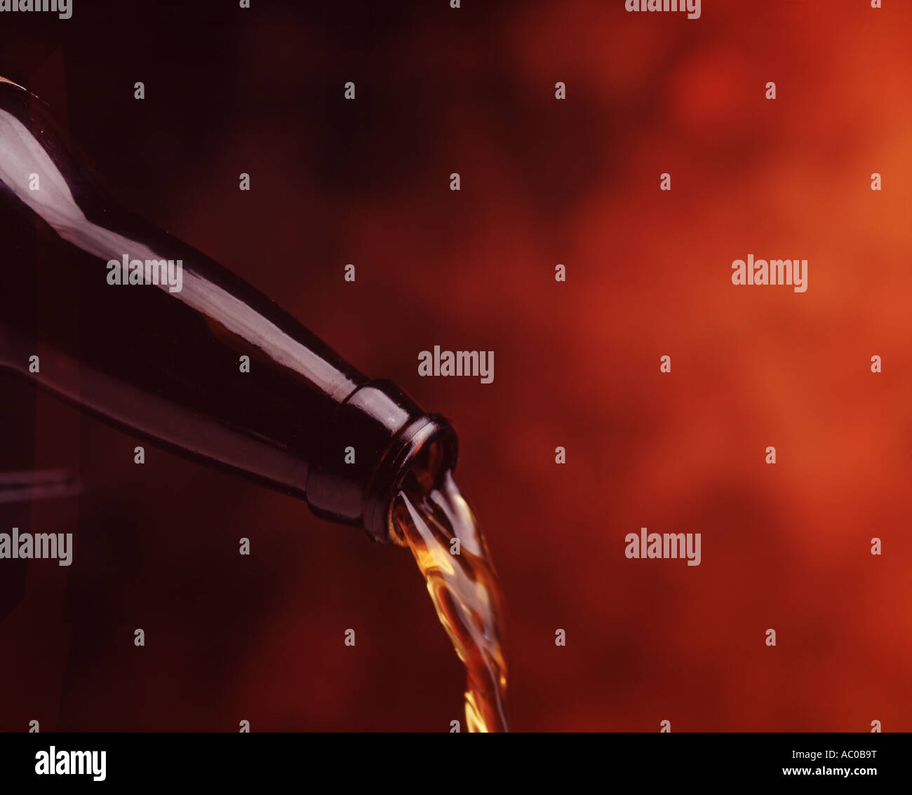 pour pouring liquid beer long neck bottle close up copy space Stock ...