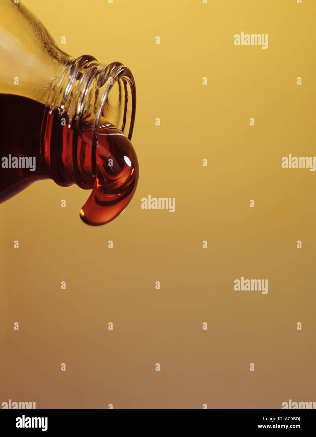 pour pouring syrup bottle close up copy space Stock Photo - Alamy