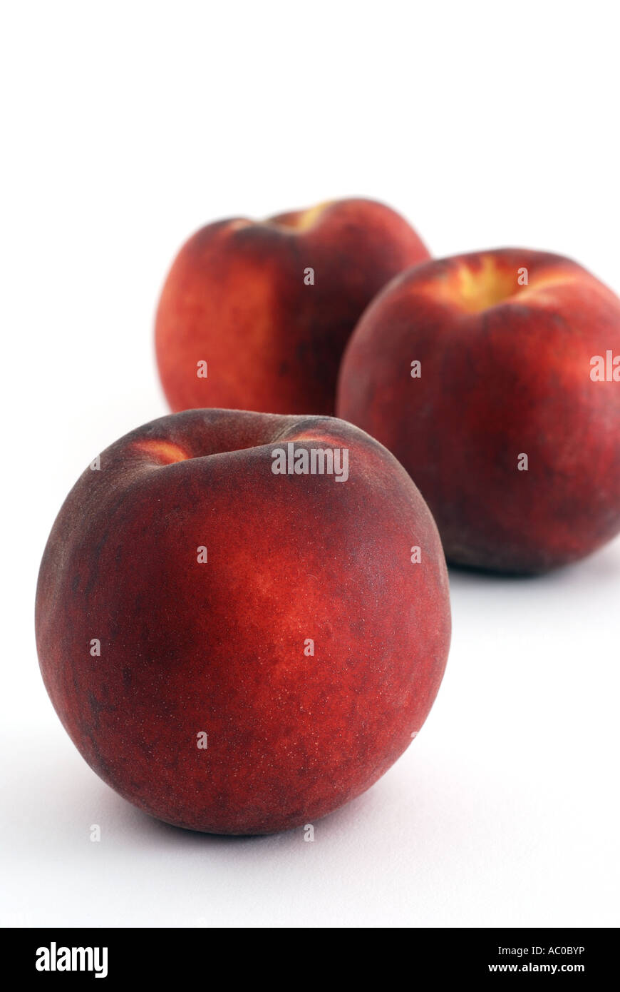FRESH ORGANIC YELLOW FLESH PEACHES ON A WHITE BACKGROUND VARIETY: ROYAL ...