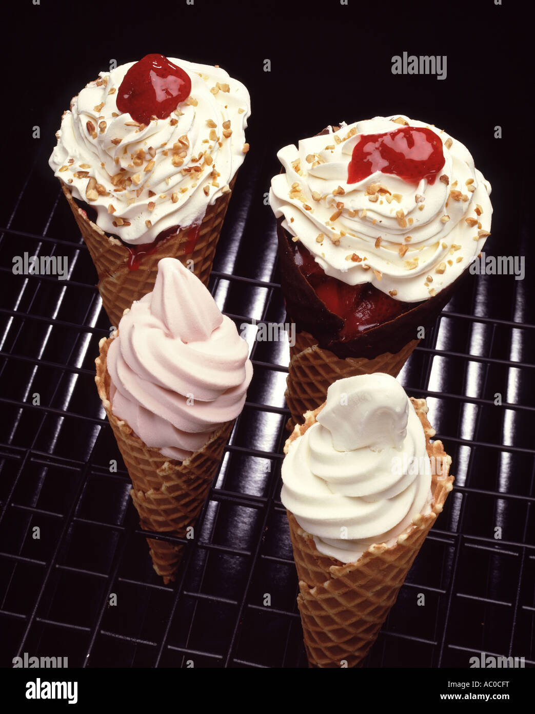 large sugar cones soft ice cream cherry sprinkles nuts whipped cream ...