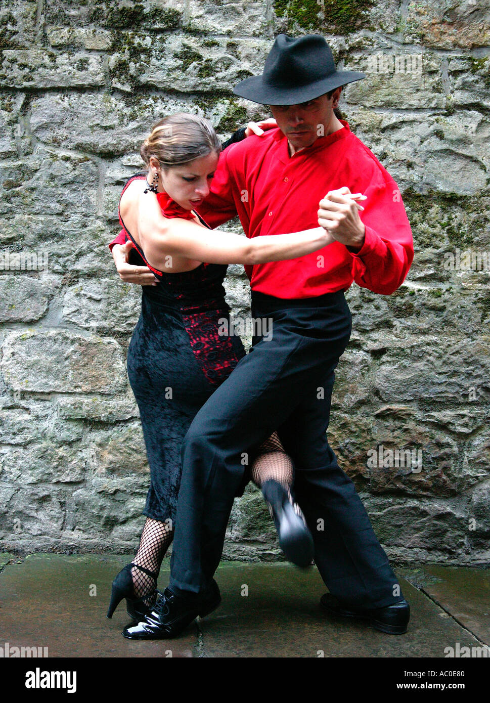 Argentinian Tango Dancers performing the ganchos move in the street ...