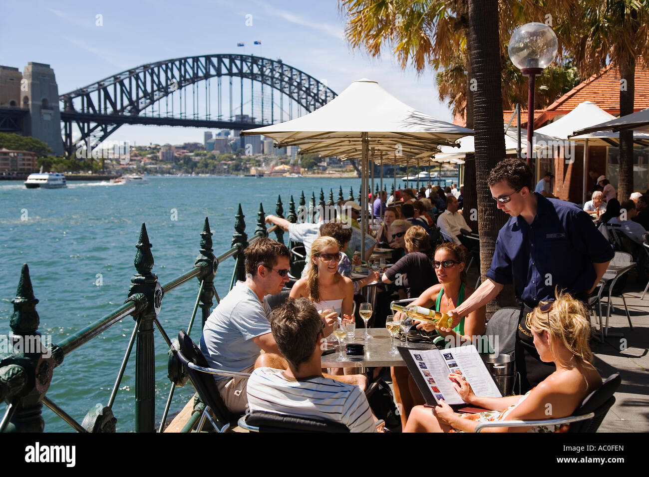 Waterfront dining at Circular Quay with views over Sydney harbour Stock ...