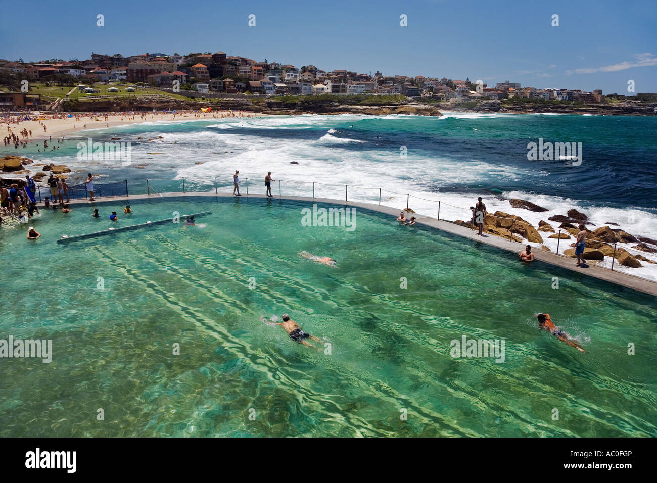 Swimmers do laps at the Bronte baths ocean filled pools flanking the ...