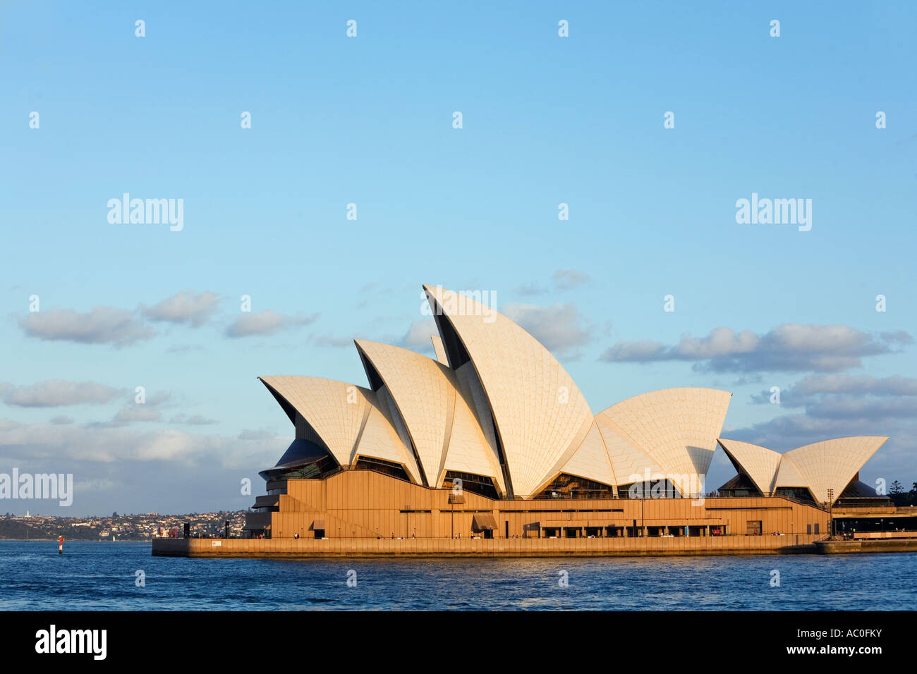 Afternoon light illuminates the iconic Sydney Opera House at Bennelong ...