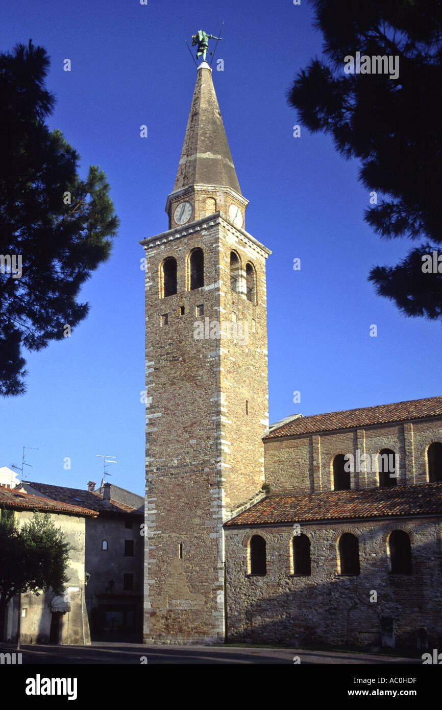 The clock tower of the Basilica of St Eufemia in the town of Grado in ...