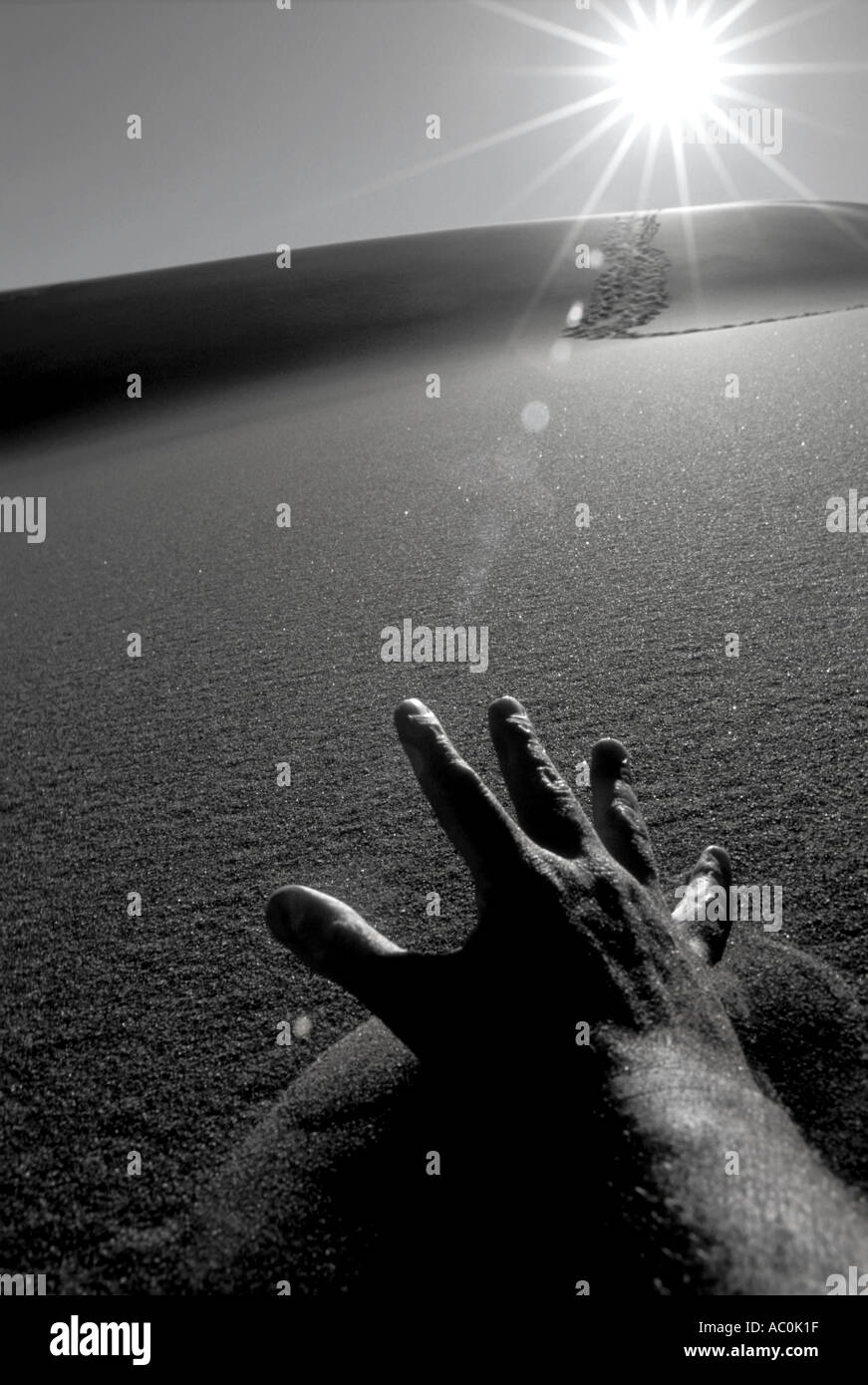 Person Under Sand In Desert High Resolution Stock Photography and ...