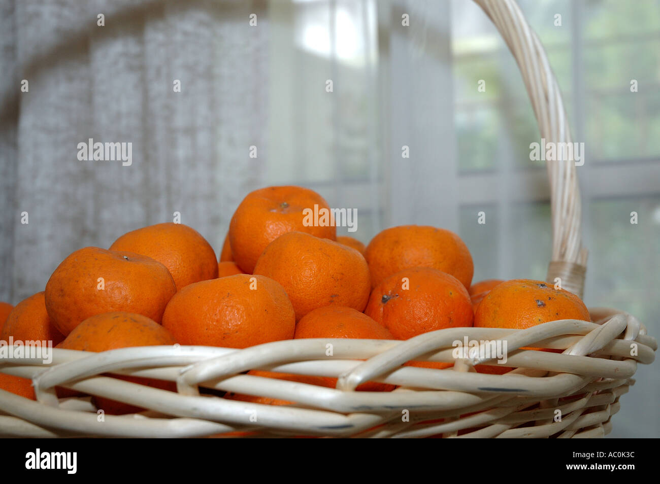 Mandarin orange in a basket Stock Photo - Alamy