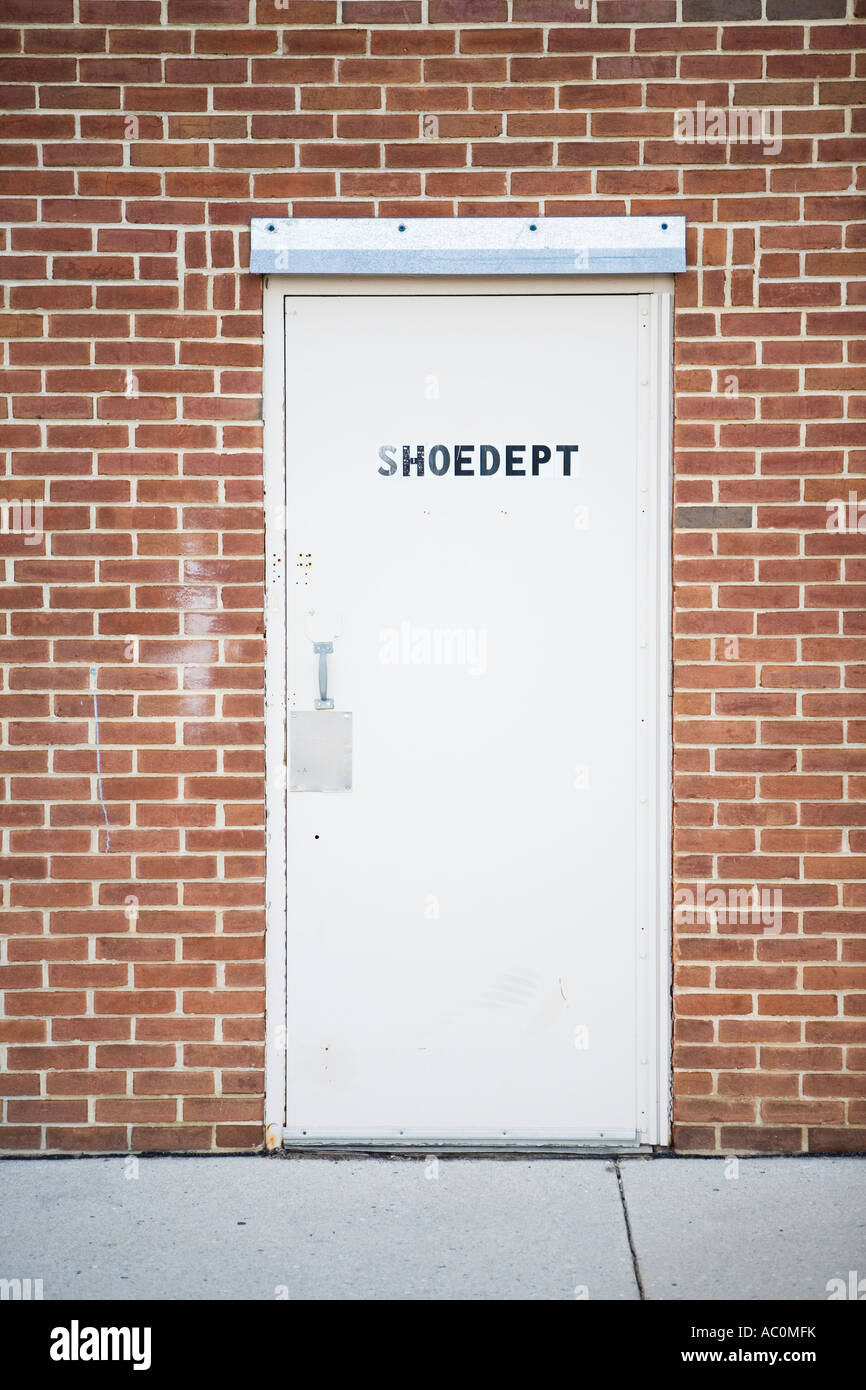 A backdoor entrance to a stoor within a mall reading shoe department ...