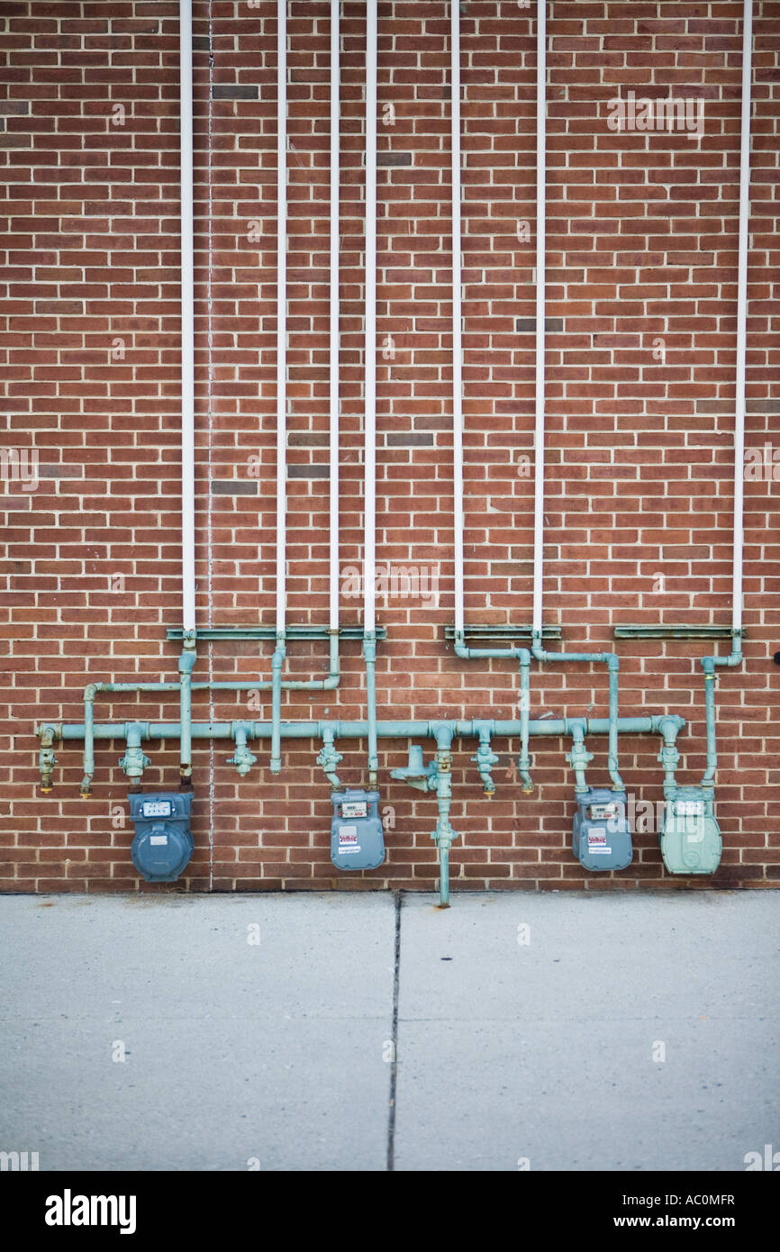Piping and electric meters Stock Photo - Alamy