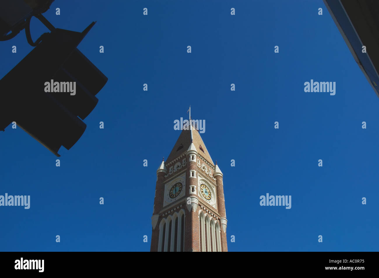 Western Australia Perth City Hall Tower with traffic light silhouette ...