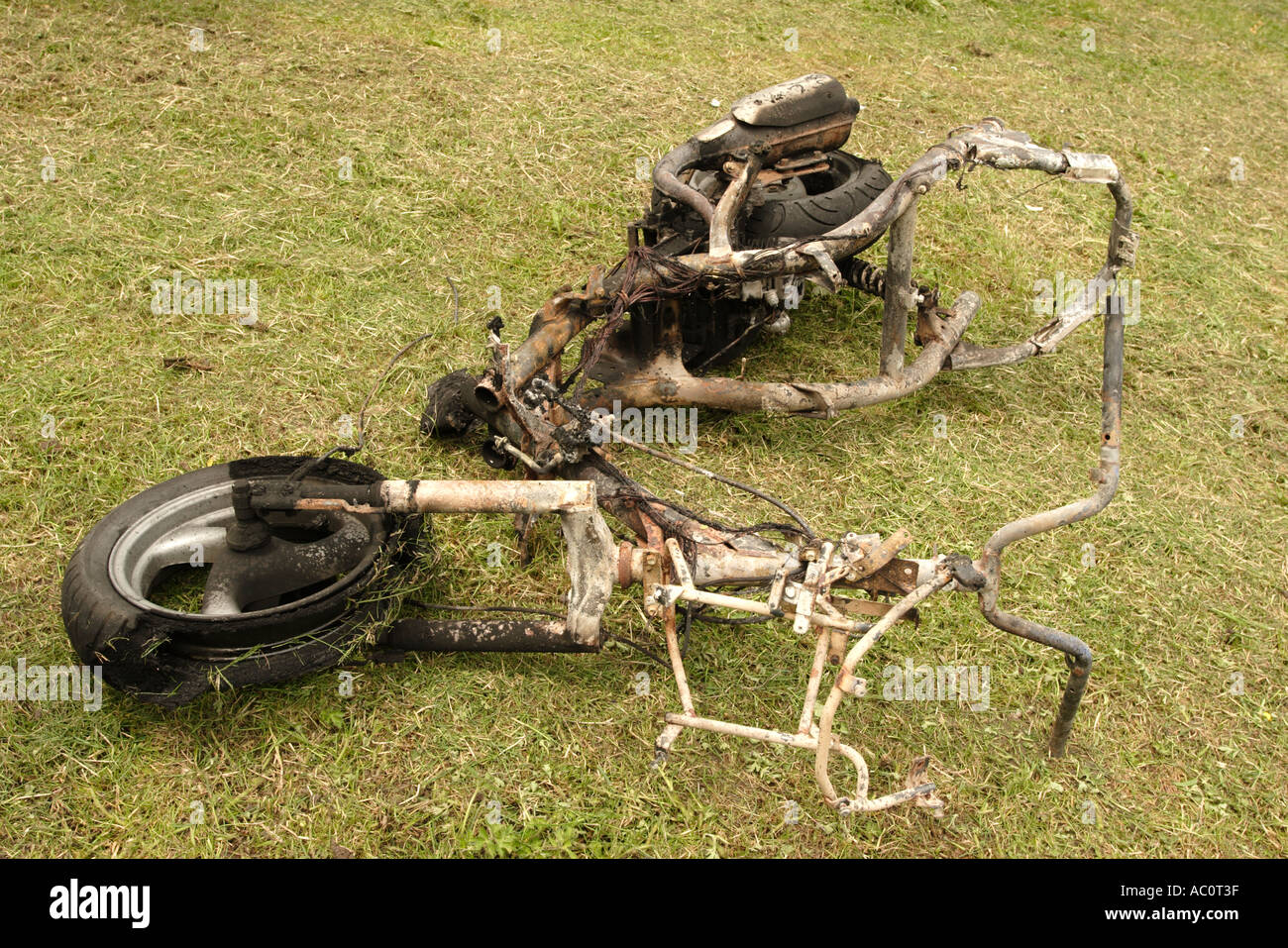 Moped wrecked by arsonists Stock Photo - Alamy