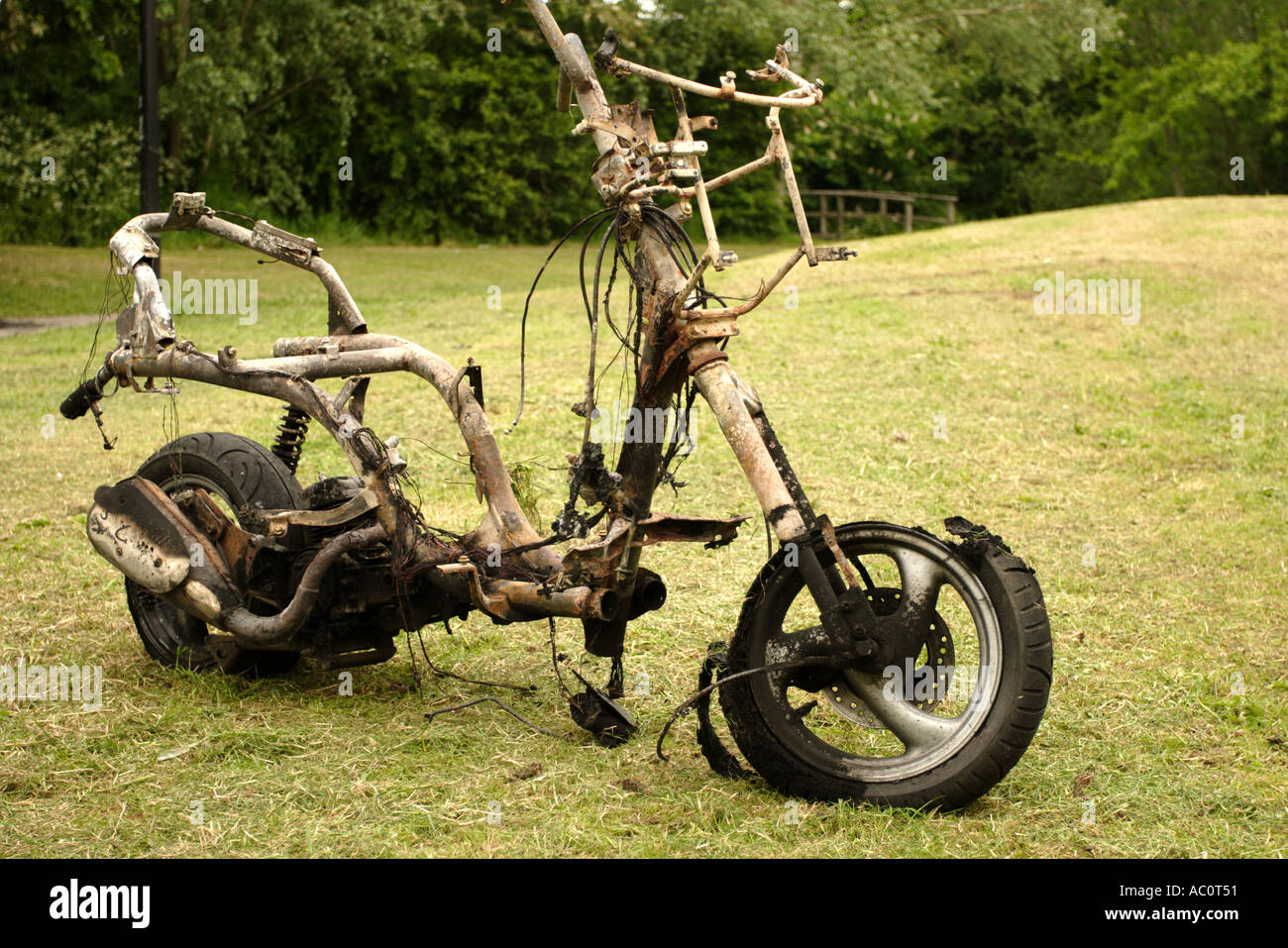 Moped wrecked by arsonists Stock Photo - Alamy