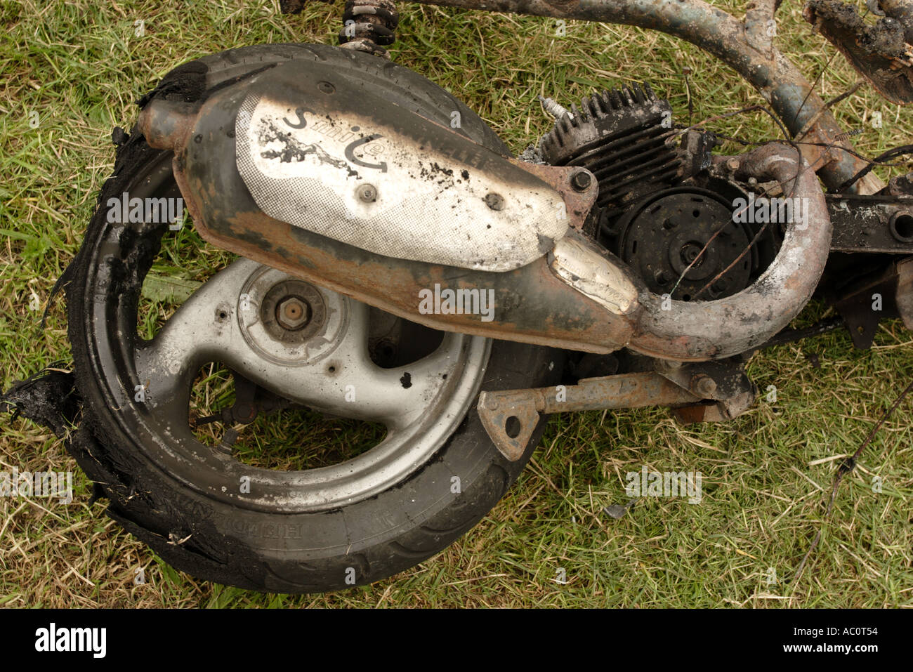 Moped wrecked by arsonists Stock Photo - Alamy