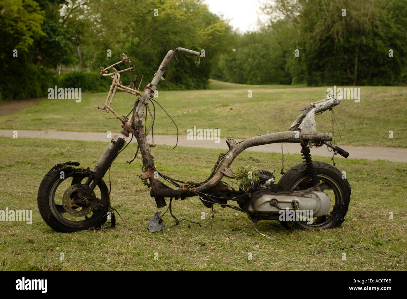 Moped wrecked by arsonists Stock Photo - Alamy