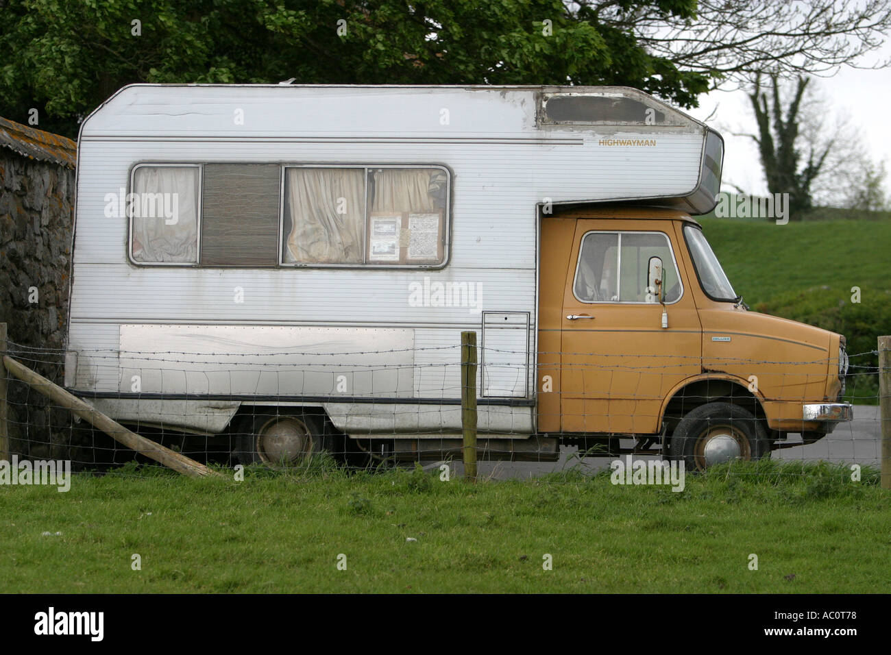 Ancient camper van with lots of interesting signs and objects in the ...