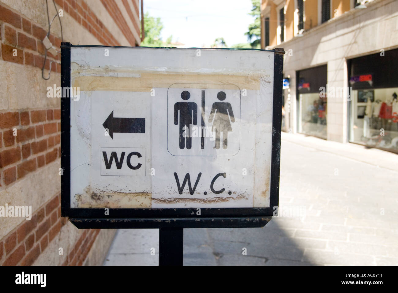 a public toilet sign in italy Stock Photo - Alamy