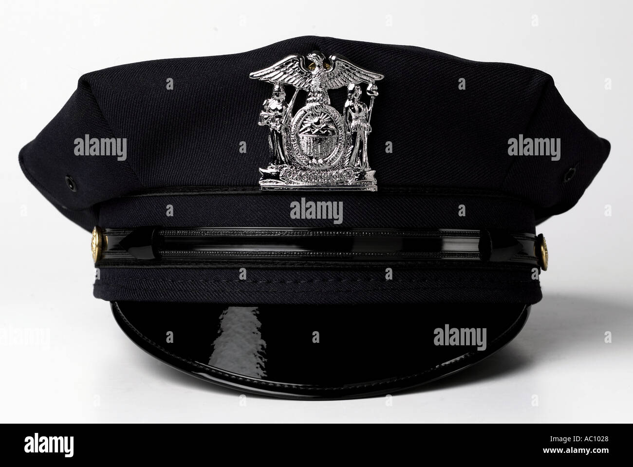 Black police hat with emblem Stock Photo - Alamy