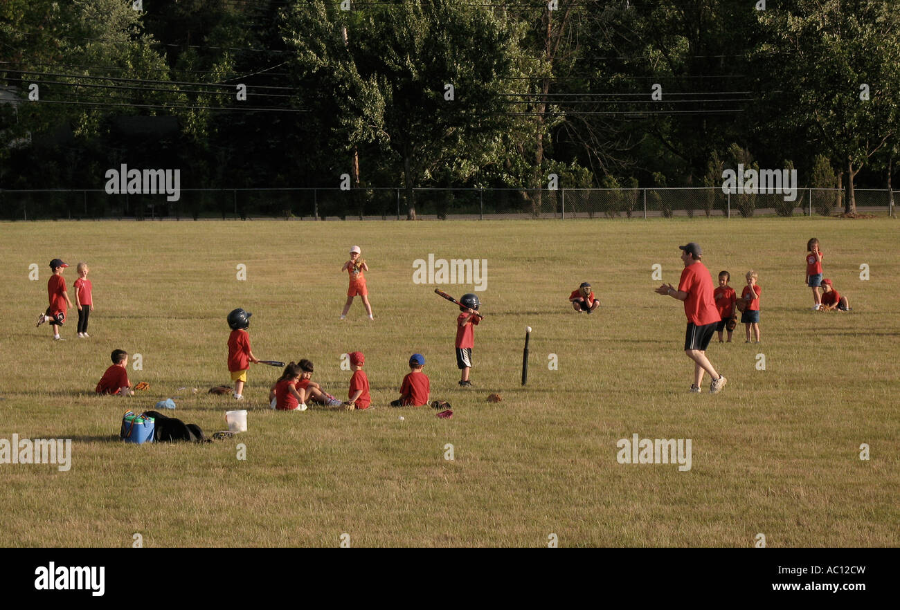 Learning to play baseball Stock Photo - Alamy