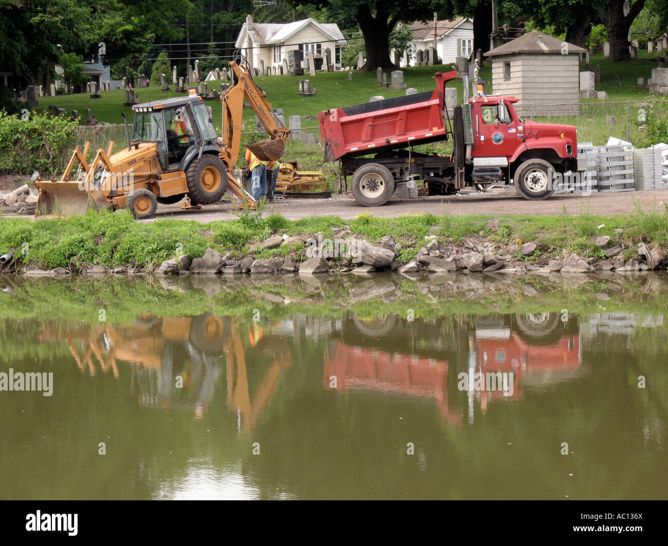 Backhoe loading truck Stock Photo - Alamy