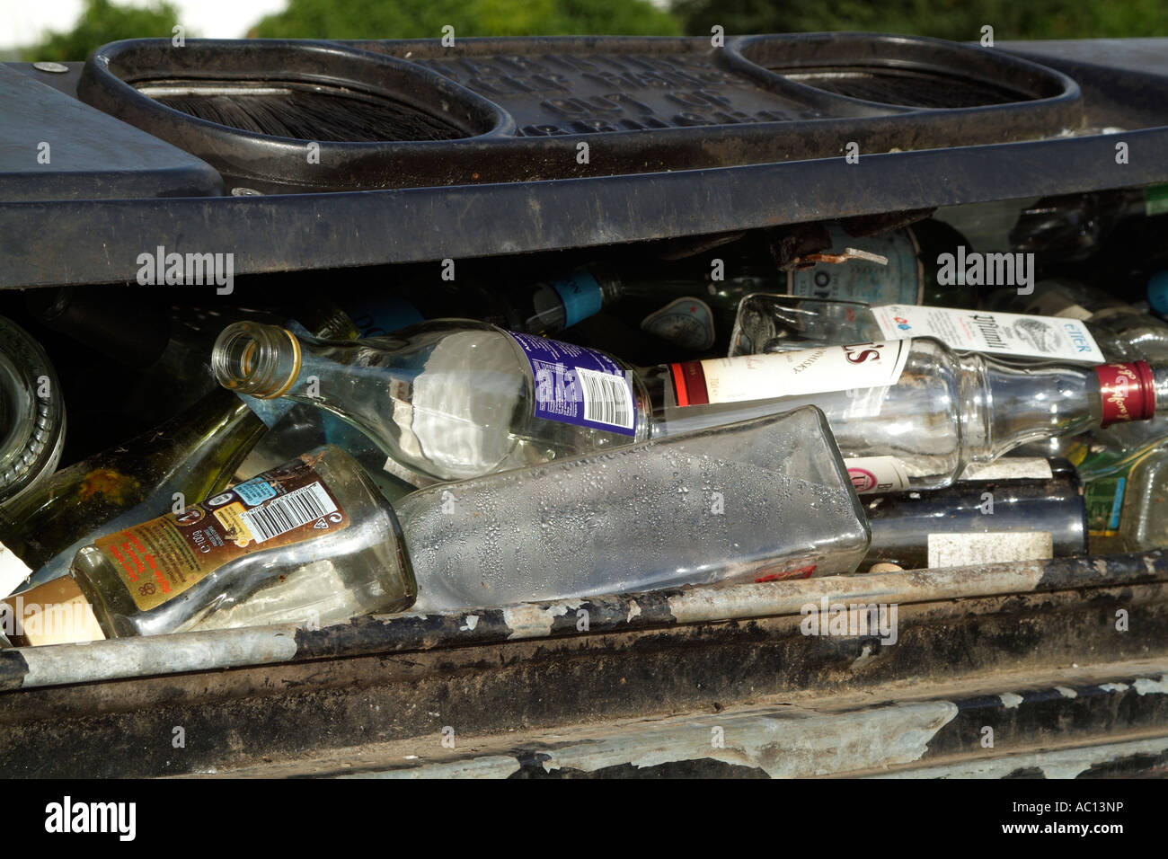 Glass recycling collection point Overfilled bins Stock Photo - Alamy