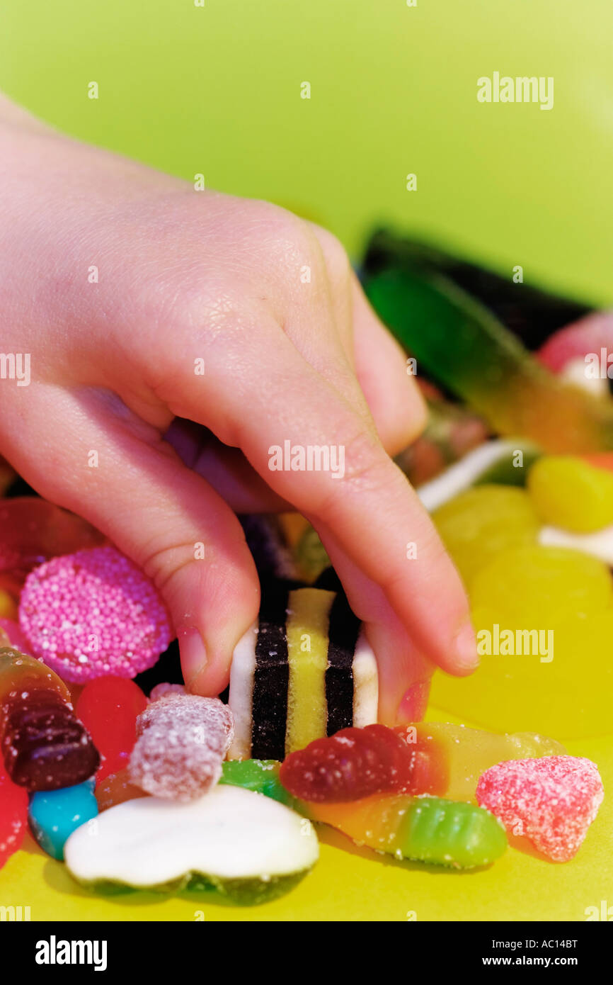child's hand picking candies Stock Photo - Alamy