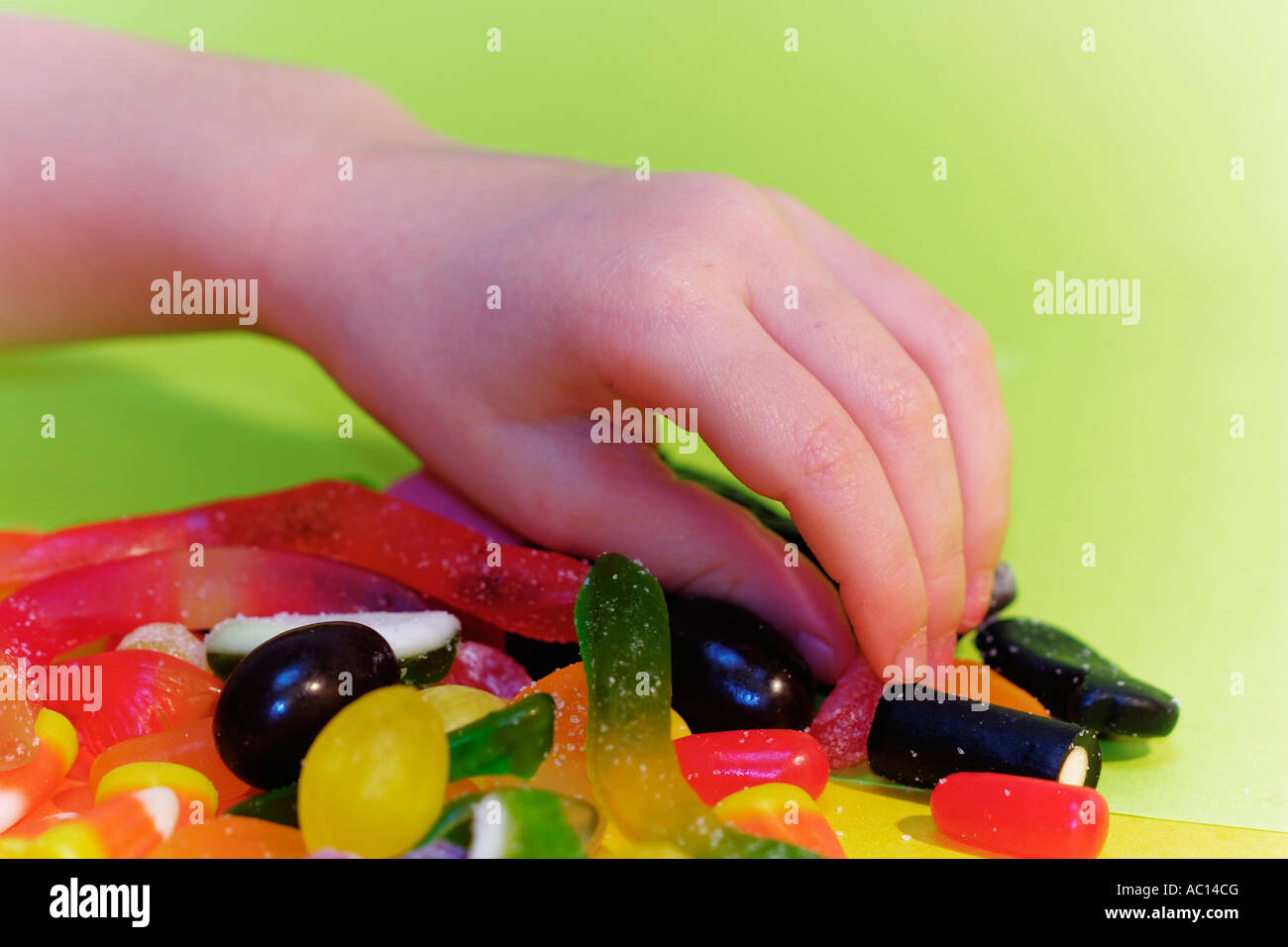 child's hand picking candies Stock Photo - Alamy