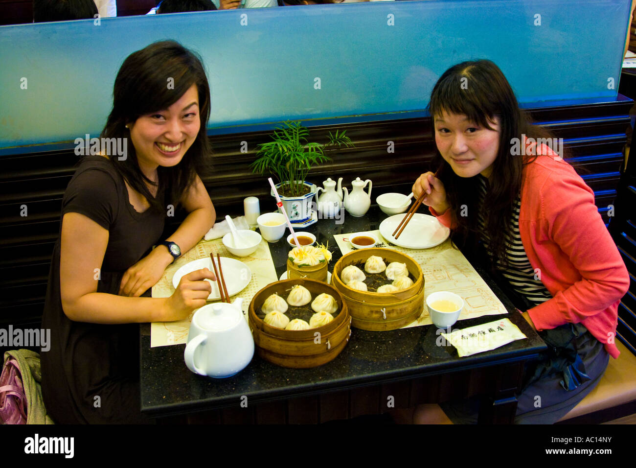 Two Young Chinese Women Enjoying Nanxiang Dumpling House Yuyuan Bazaar
