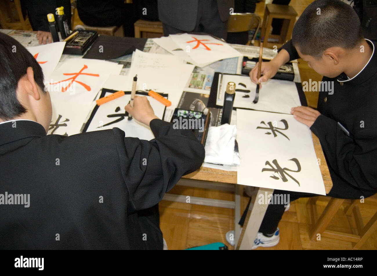 Japanese students practicing calligraphy Stock Photo - Alamy