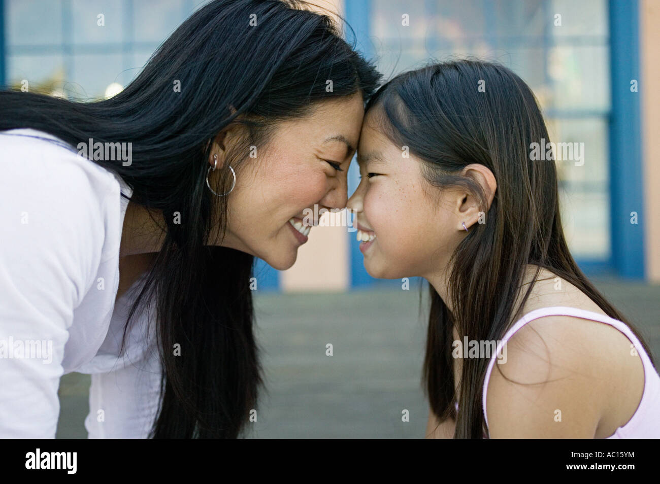 Mother and Daughter Touch Noses Stock Photo - Alamy