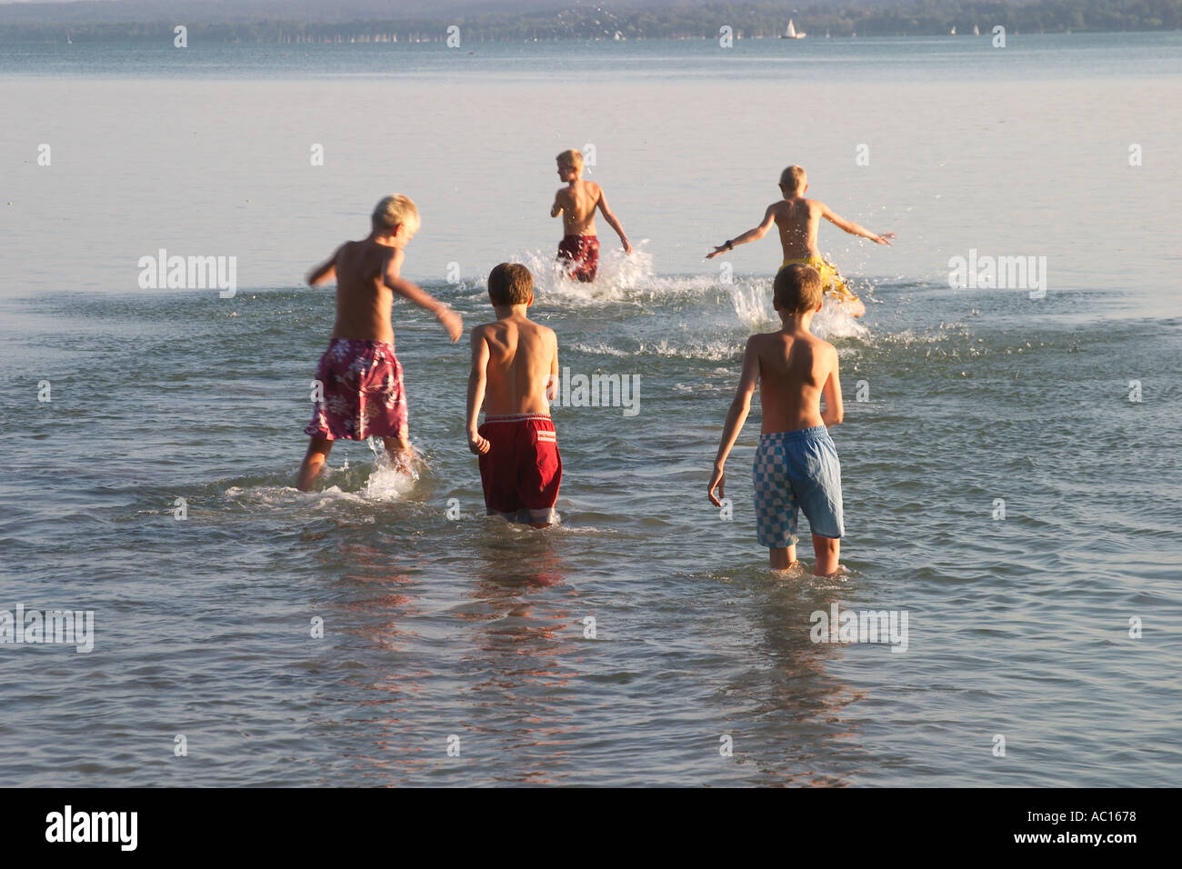 Happy boy run lake hi-res stock photography and images - Alamy