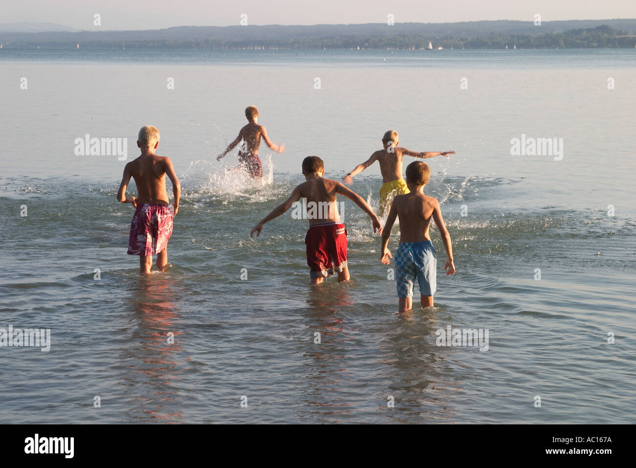 Happy boy run lake hi-res stock photography and images - Alamy