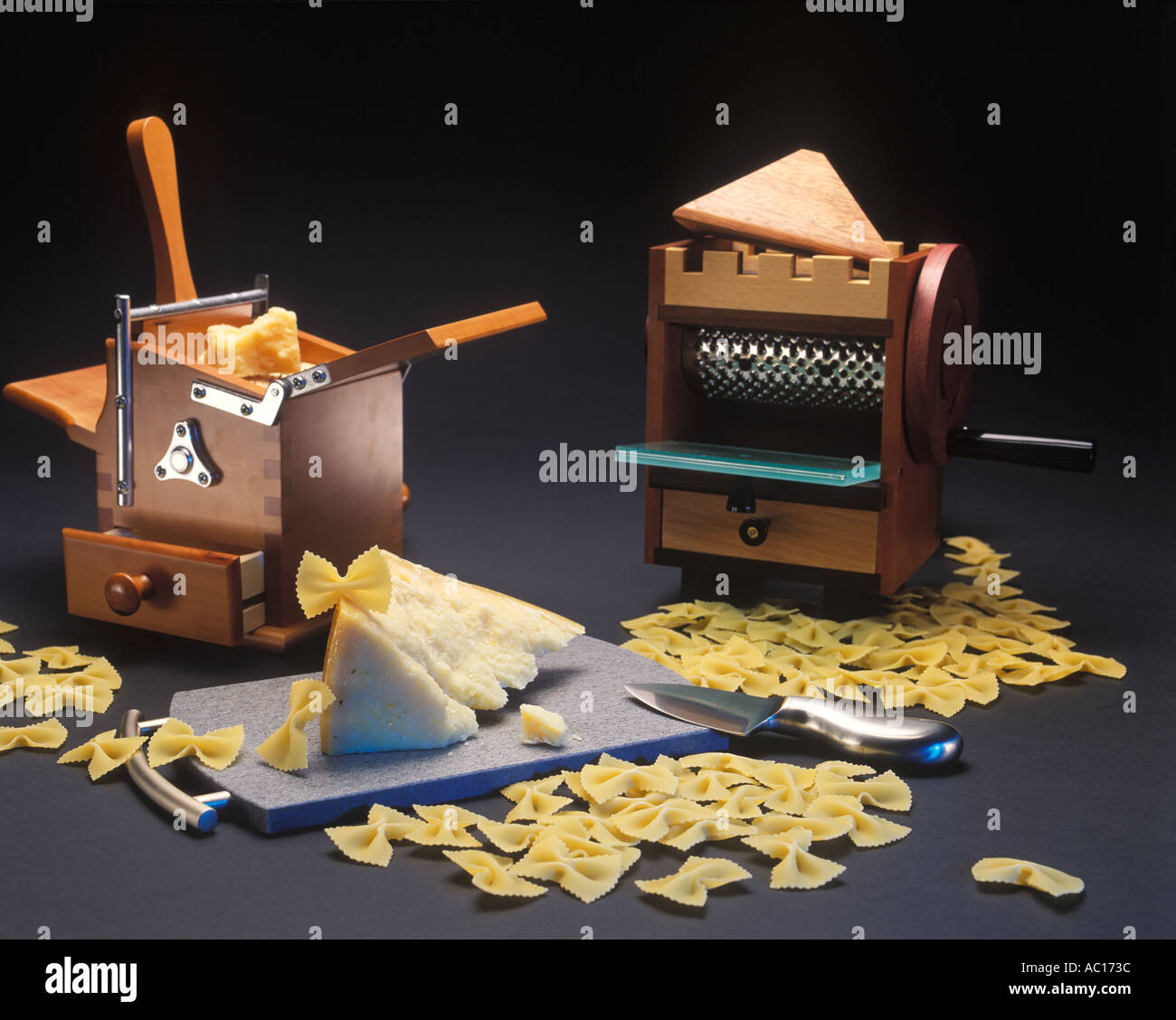 Parmesan grinder machines and noodles Stock Photo - Alamy