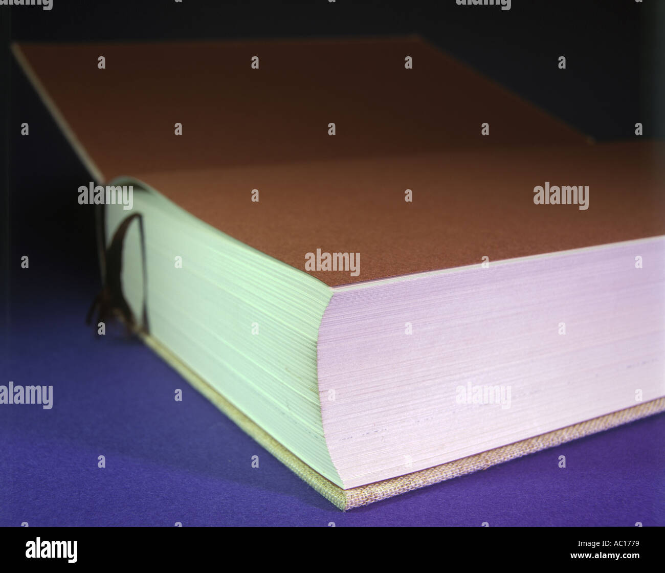 Thick open book Stock Photo - Alamy