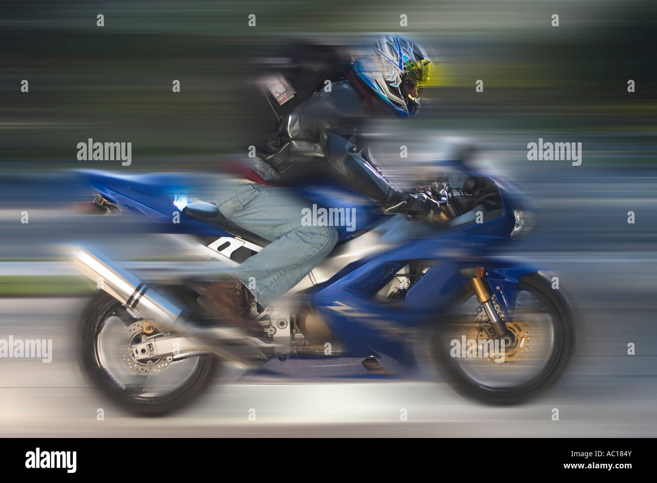 Man on motorbike speeding Stock Photo - Alamy