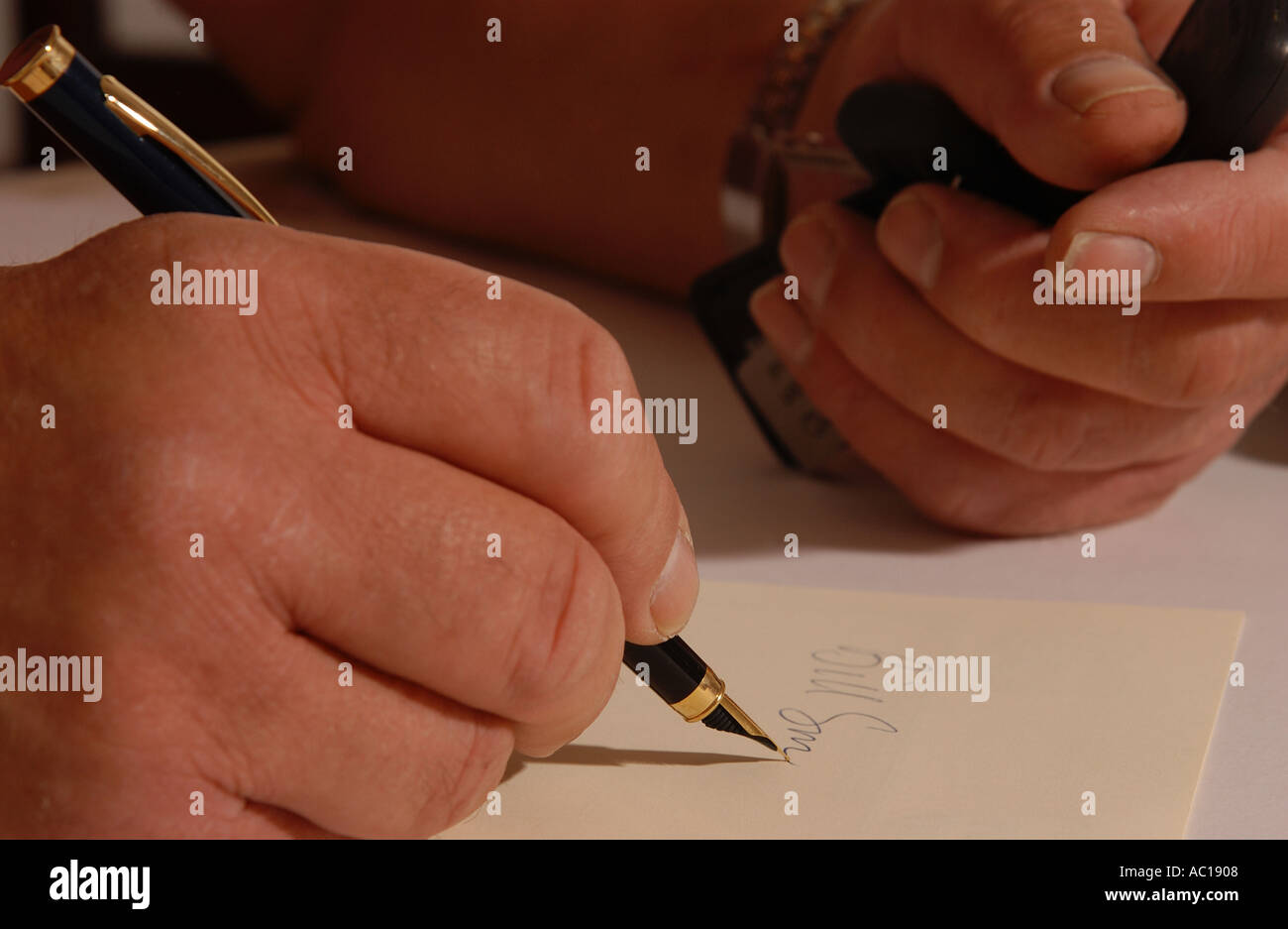 Human hand writing with pen Stock Photo - Alamy