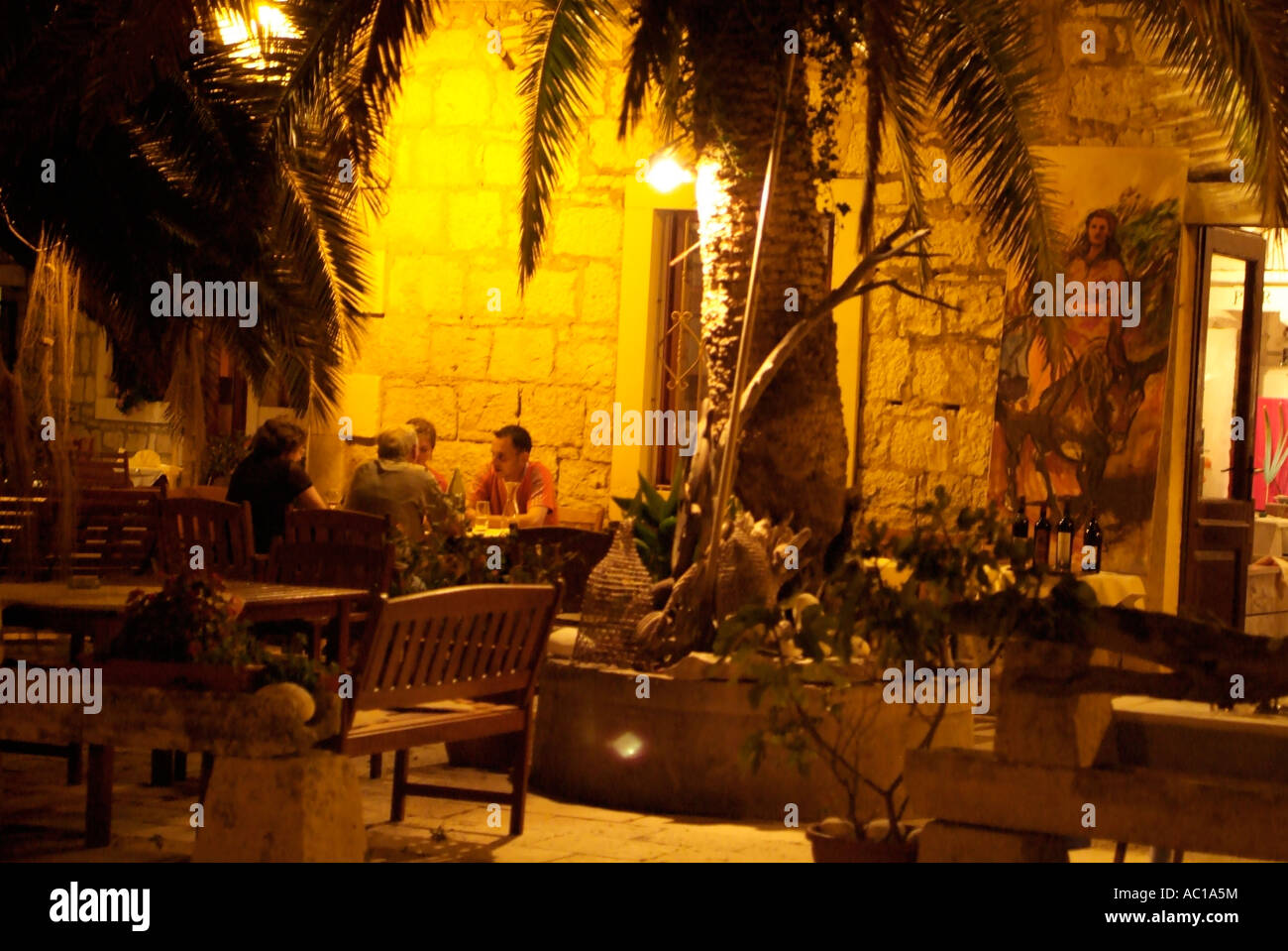 Outdoor restaurant in Stari Grad at night on Island of Hvar, Croatia ...