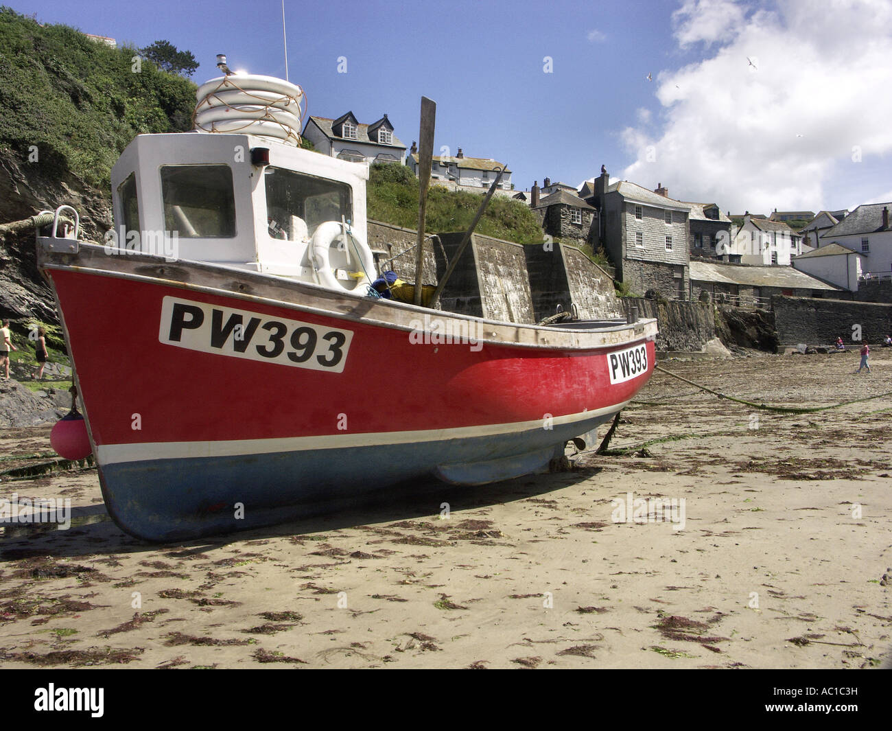 A fishing boat in Port Isaac harbour Stock Photo - Alamy