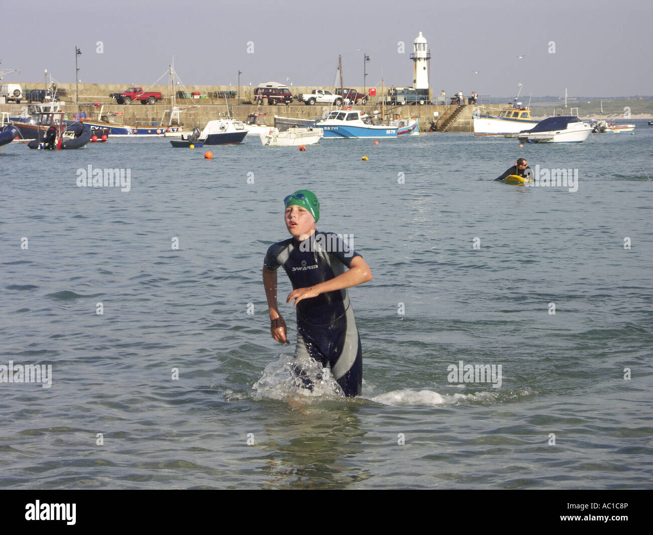 Another swimmer powers to the finish line Stock Photo - Alamy