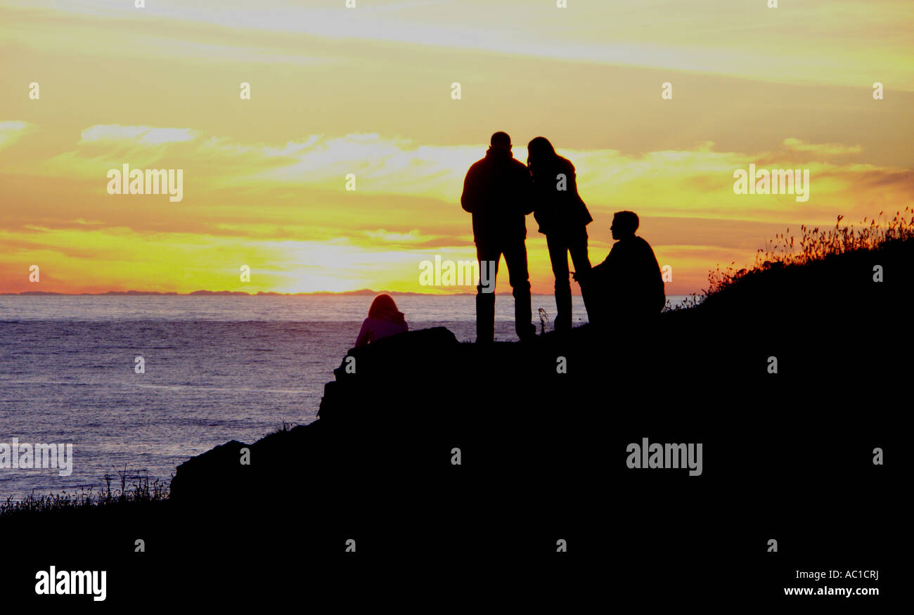 Enjoying the sunset on St Ives 'island' Stock Photo - Alamy