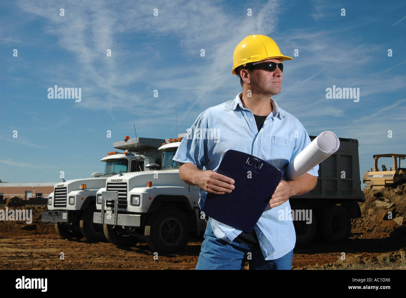 Construction man with plans Stock Photo - Alamy