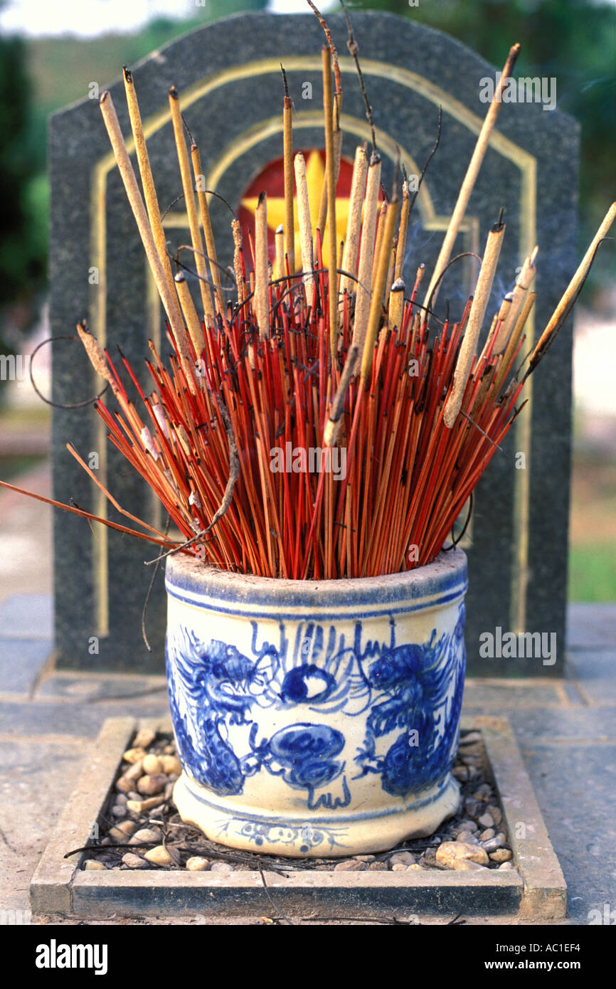 Incense offering on a grave in the Dien Bien Phu Cemetary Stock Photo ...