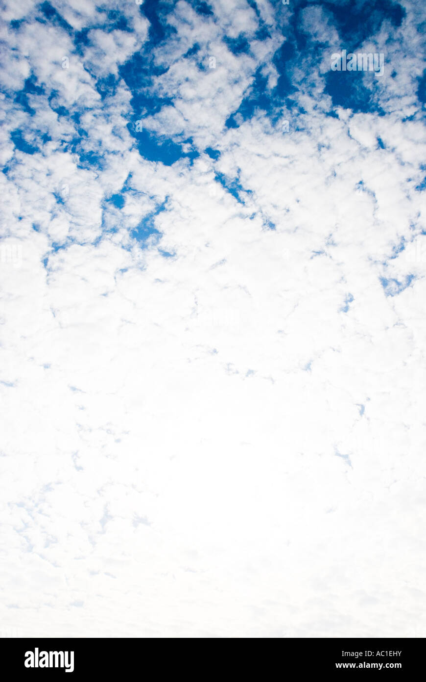 very bright white clouds in back lit and a bit of blue sky Stock Photo ...