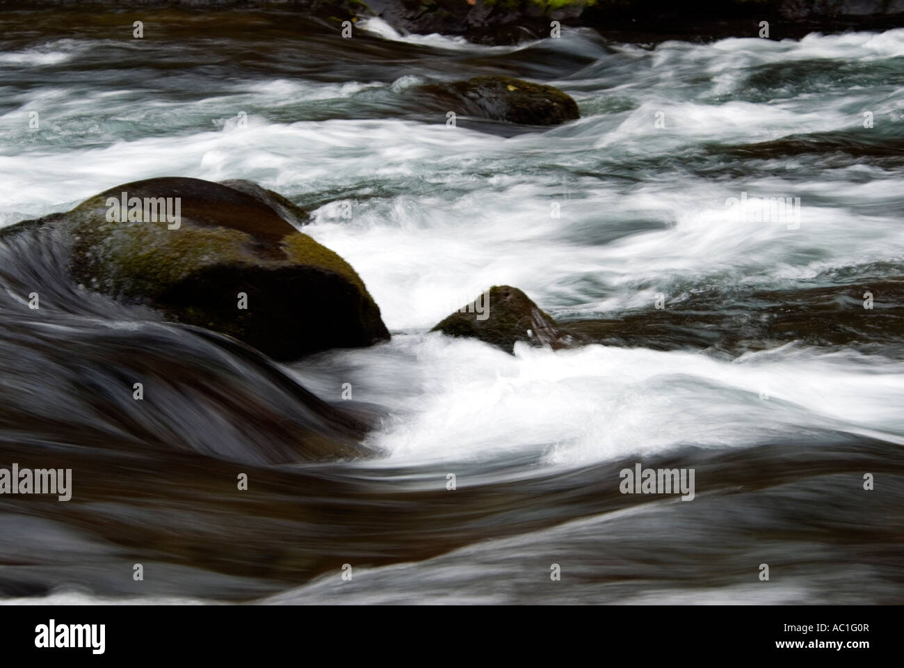 water rushes through boulders. Slow shutter speed. USA Stock Photo - Alamy
