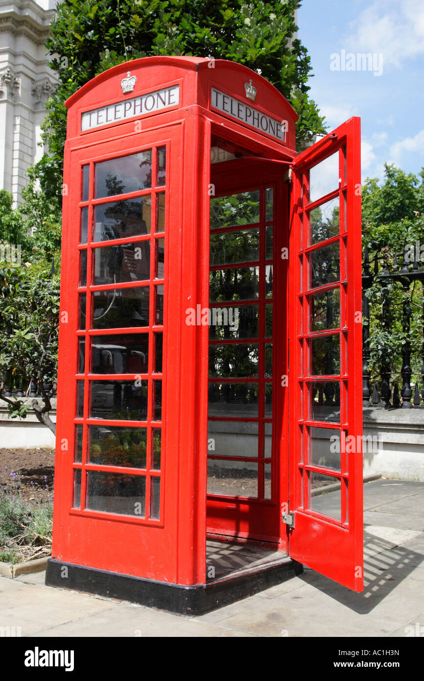 red telephone box along cannon street london england Stock Photo - Alamy