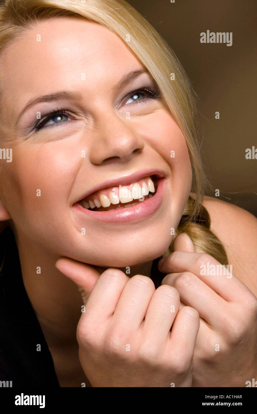 Portrait of blonde woman beaming with joy Stock Photo - Alamy