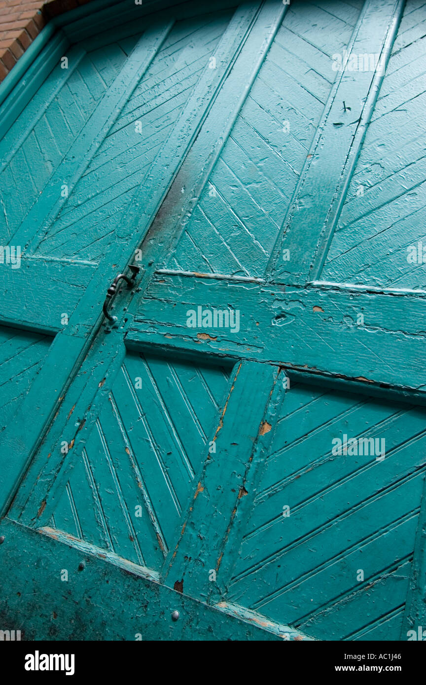 Old service doors at the back of industial building Stock Photo - Alamy