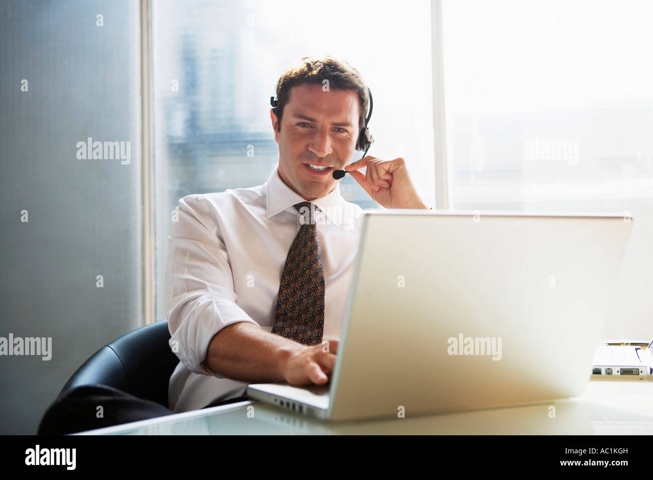 Business people headsets using computers hi-res stock photography and ...